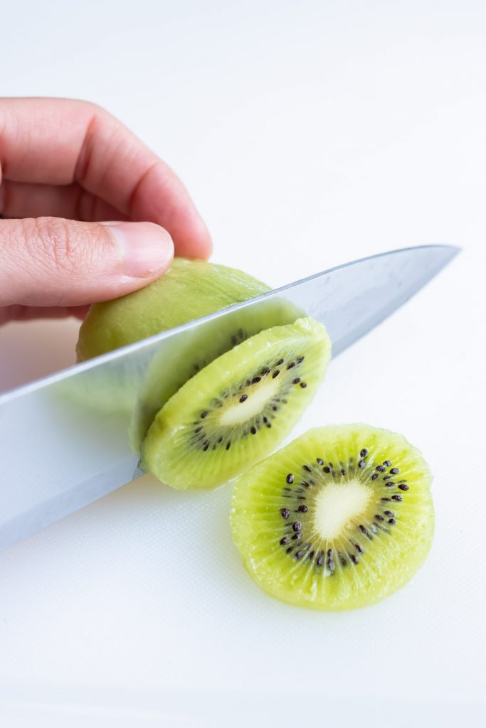 How to Cut a Kiwi (3 Easy Ways!) - Evolving Table