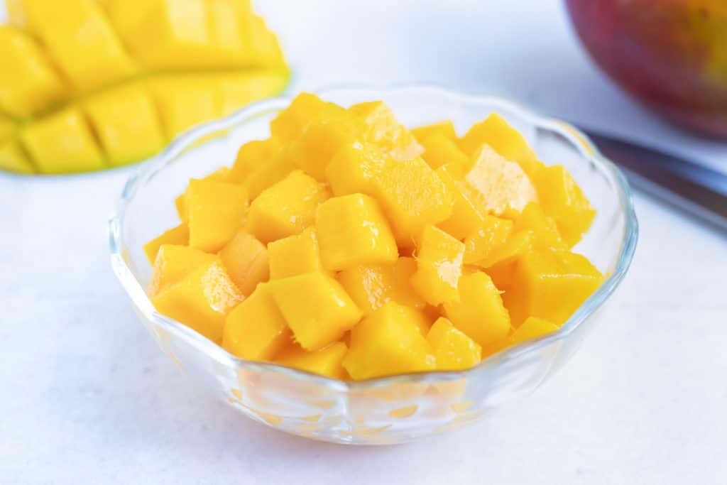 How to Cut a Mango (2 Easy Ways!) - Evolving Table